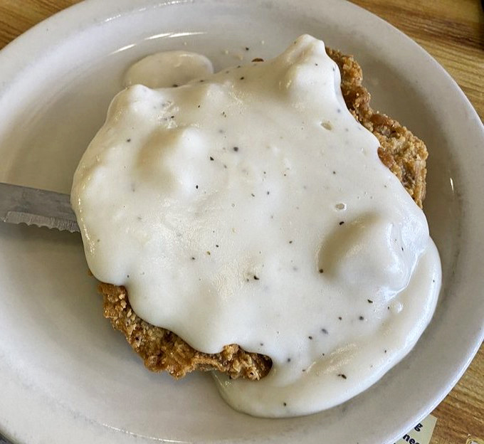 Behold the star attraction: country fried steak smothered in peppery white gravy. This isn't just food&mdash;it's edible therapy for whatever ails you.