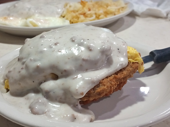 The legendary country fried steak, smothered in gravy that should be bottled and sold as therapy. Worth every mile of your journey.