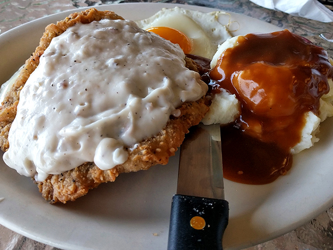 Country fried steak smothered in gravy alongside eggs and mashed potatoes&mdash;the breakfast equivalent of a warm hug from your favorite aunt.