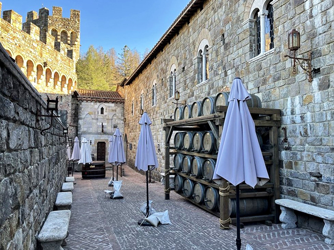 Wine barrels line the stone courtyard walls where folded umbrellas await sunny California days&mdash;a scene Michelangelo might have painted if he'd been into viticulture.