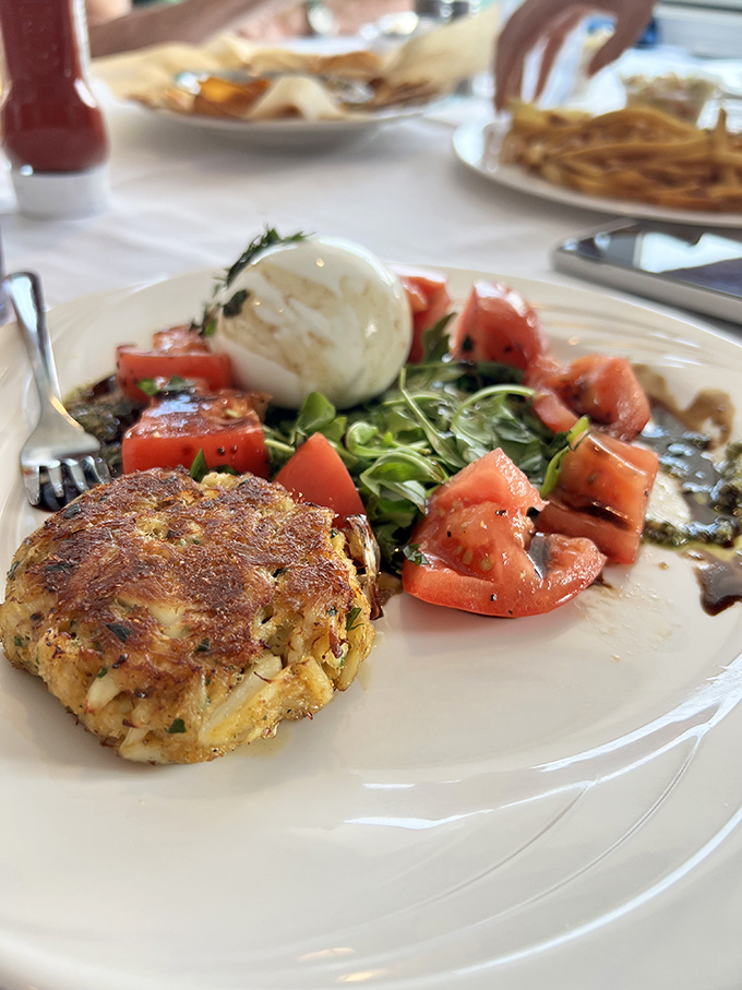Golden-brown perfection meets minimal filler in this crab cake masterpiece. It's what happens when Maryland's signature dish is treated with the respect it deserves.