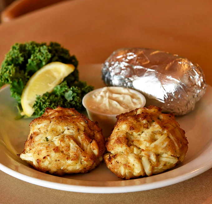 These golden-brown crab cakes aren't just dinner; they're edible love letters from the Chesapeake Bay, packed with sweet jumbo lump meat.