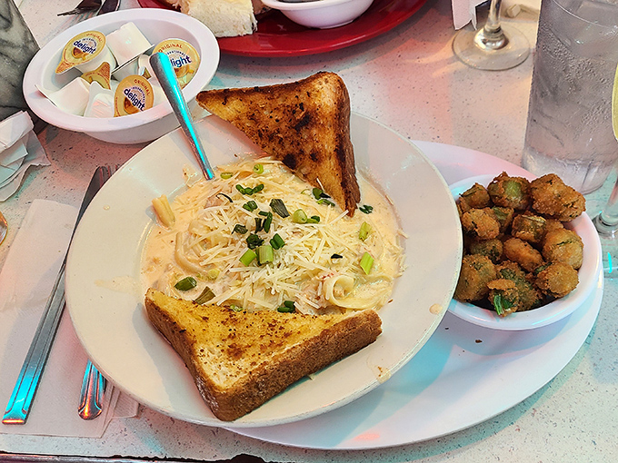 The legendary Crawfish Savannah arrives like a warm hug on a plate, with buttery toast standing by to ensure not a drop of that heavenly sauce goes to waste.