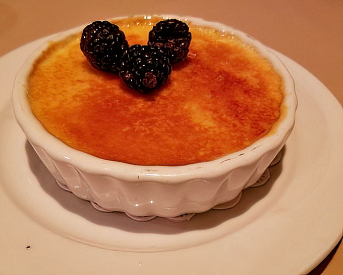 The star of our show: a cr&egrave;me br&ucirc;l&eacute;e with a sugar crust so perfectly torched it makes that signature "crack" sound that's music to dessert lovers' ears.