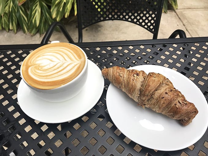 The perfect pairing doesn't exi&mdash; Oh wait, it does. This artful latte and buttery croissant combo is breakfast nirvana on a patio table.