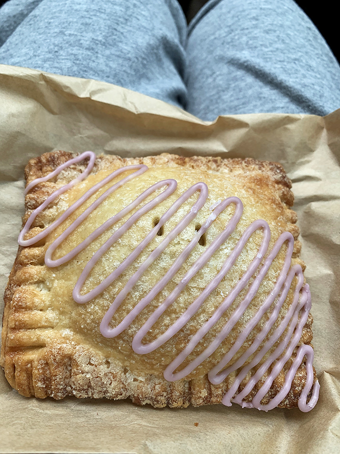 Pastry perfection doesn't need to shout. This crostata whispers sweet nothings with its flaky crust and lavender icing, like dessert poetry on parchment paper.