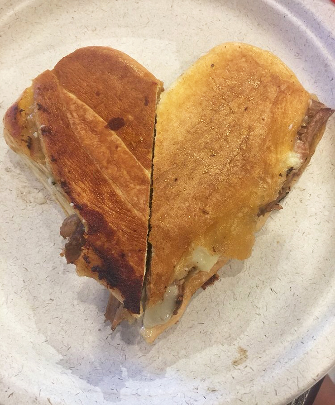 The Cuban sandwich arrives like a perfectly pressed postcard from Havana&mdash;crispy exterior giving way to a harmony of pork, ham, and pickles.