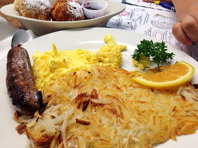 Breakfast of champions: golden hash browns, fluffy scrambled eggs, and a sausage that would make Thor himself put down his hammer.