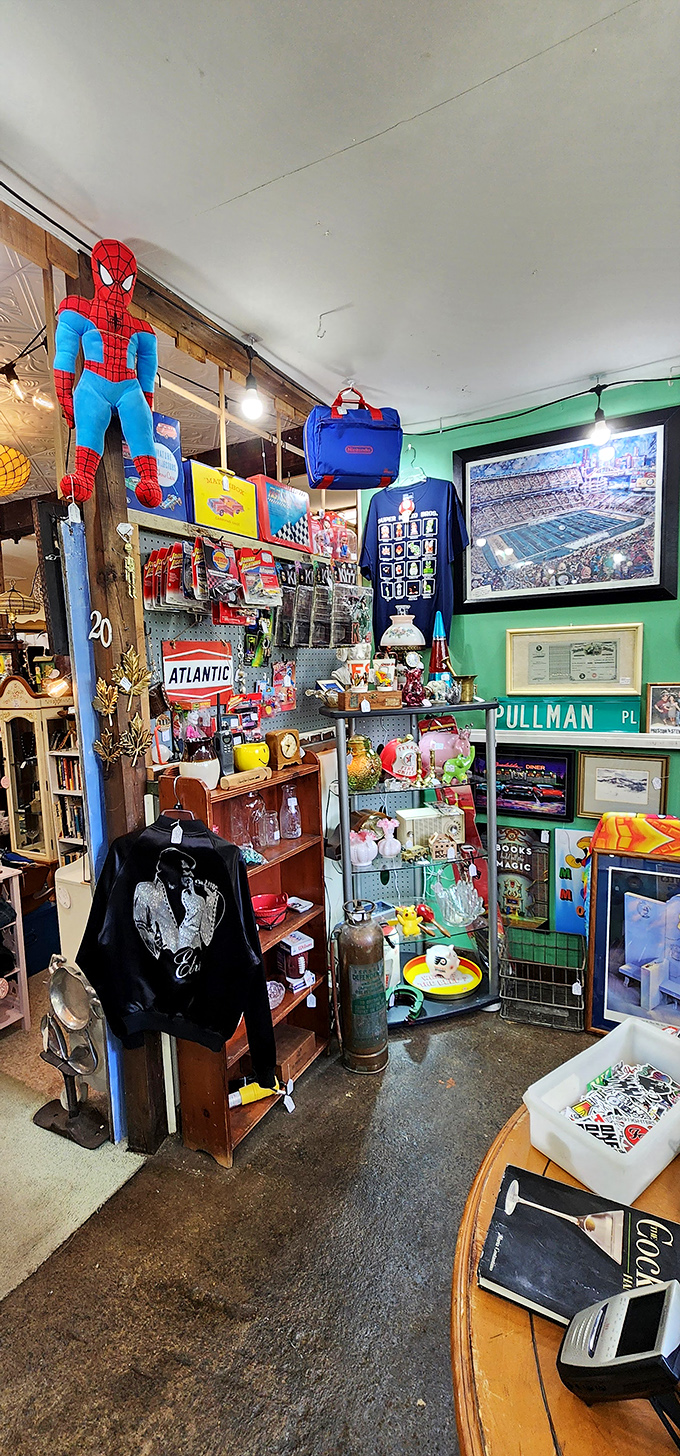 Spider-Man keeping watch over a pop culture paradise! This corner blends nostalgic memorabilia with vintage signage for the ultimate collector's dream.