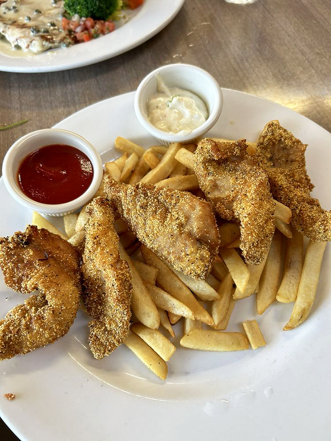 Golden-crusted cod that shatters with each bite, revealing pearly flesh within. The French fries aren't just along for the ride&mdash;they're worthy companions.