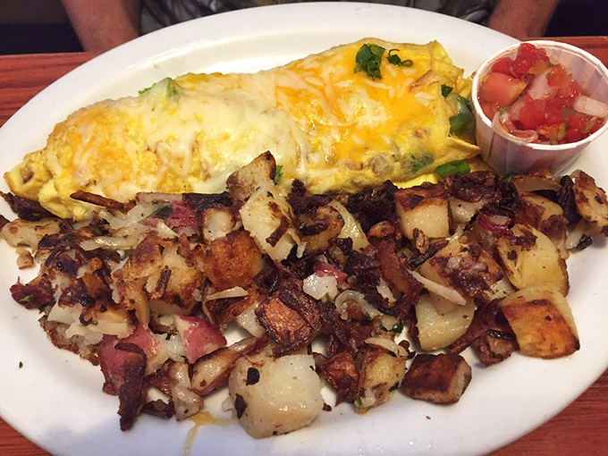 The Denver omelet arrives with potatoes so perfectly crispy they deserve their own fan club. Cheese melts like morning sunshine.