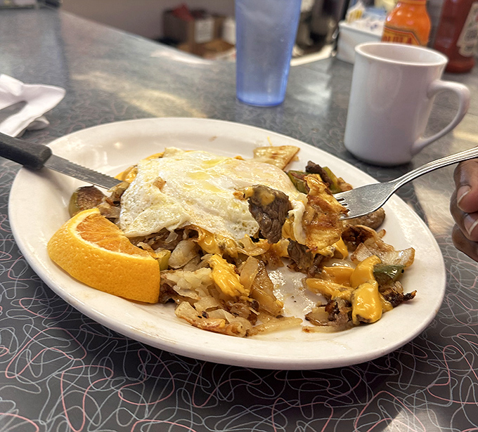 Breakfast alchemy at its finest&mdash;a skillet where eggs, cheese, and potatoes unite in a harmony that Mozart would envy.