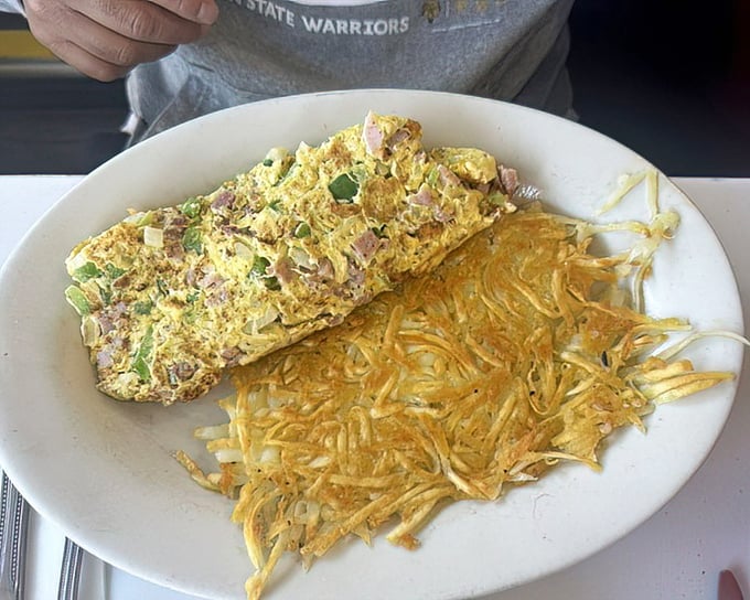 This Denver omelet doesn't just whisper "good morning"&mdash;it belts it out with a choir of ham, peppers and perfectly melted cheese alongside hash browns crisped to golden perfection.