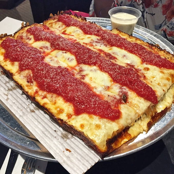Detroit-style pizza that's so perfectly caramelized at the edges, you'll wonder if cheese could win architectural awards.