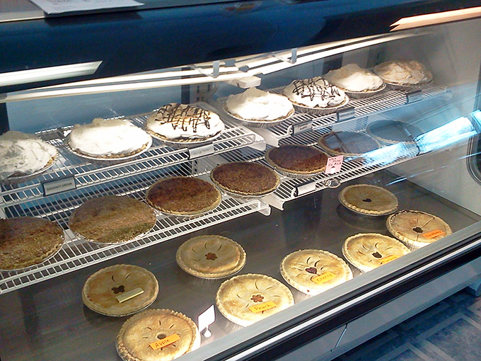 The pie case&mdash;where dreams are displayed under fluorescent lights and life decisions become infinitely more complicated. Worth every calorie-laden moment of indecision.