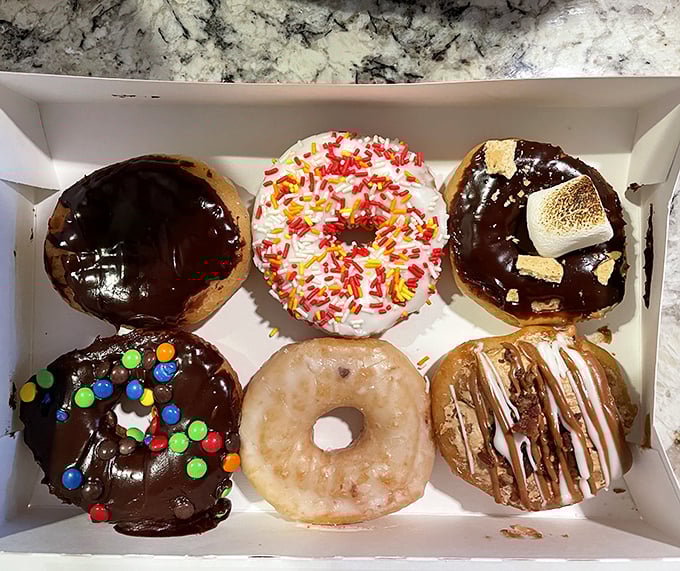 Donut heaven exists, and it comes in a box. Six different paths to bliss, each one more tempting than the last.