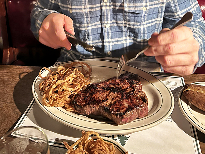 This isn't just a steak; it's a declaration of independence from trendy food fads. Those crispy onion straws are the crown jewels.