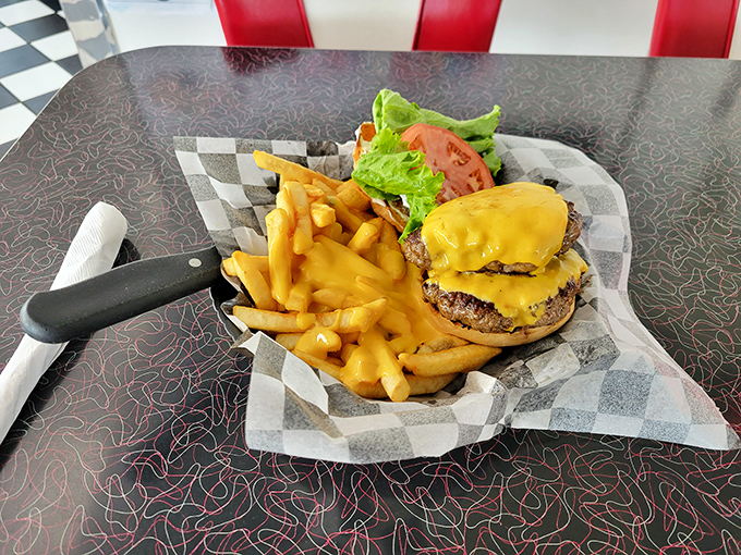This isn't just a cheeseburger&mdash;it's America between two buns. Golden fries standing at attention, ready for their delicious duty.