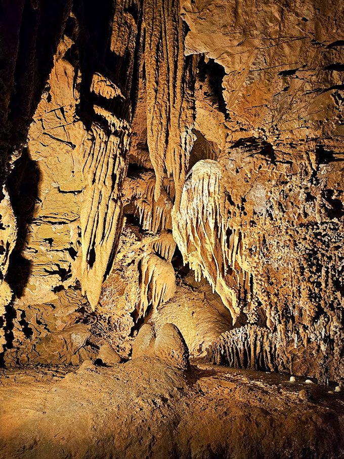 The "bacon" draperies hang from the ceiling like nature's own tapestry, each ripple telling a story thousands of years in the making.