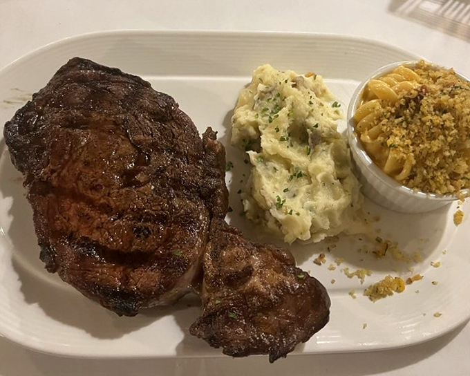 Behold the star of the show &ndash; a perfectly charred ribeye with sides that know their supporting role. This isn't dinner; it's a religious experience.