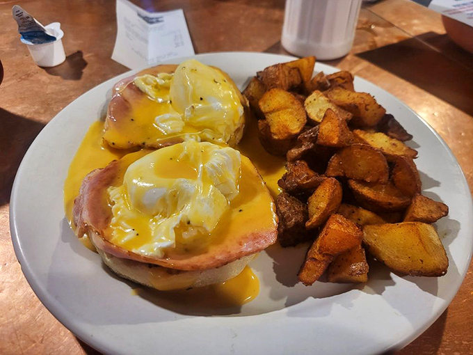 Eggs Benedict that would make a French chef weep with joy&mdash;perfectly poached eggs cascade hollandaise down Canadian bacon islands.