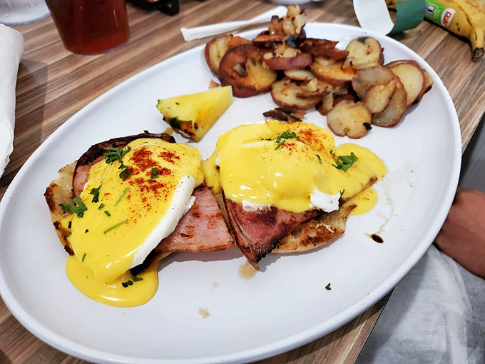 Behold, the star of the show! Golden hollandaise cascades over perfectly poached eggs and Canadian bacon &ndash; breakfast nirvana on a plate.