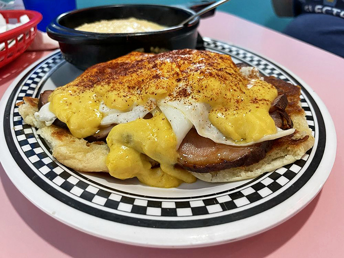 Behold the star of our show—eggs Benedict with a Southern twist. That hollandaise sauce is practically performing a victory lap around that biscuit.