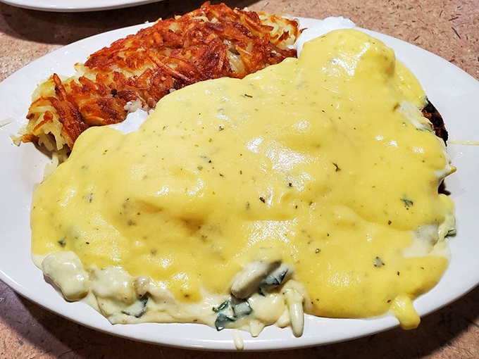 This isn't just an omelet &ndash; it's a golden masterpiece draped in hollandaise that makes you wonder why you ever settled for cereal on weekday mornings.