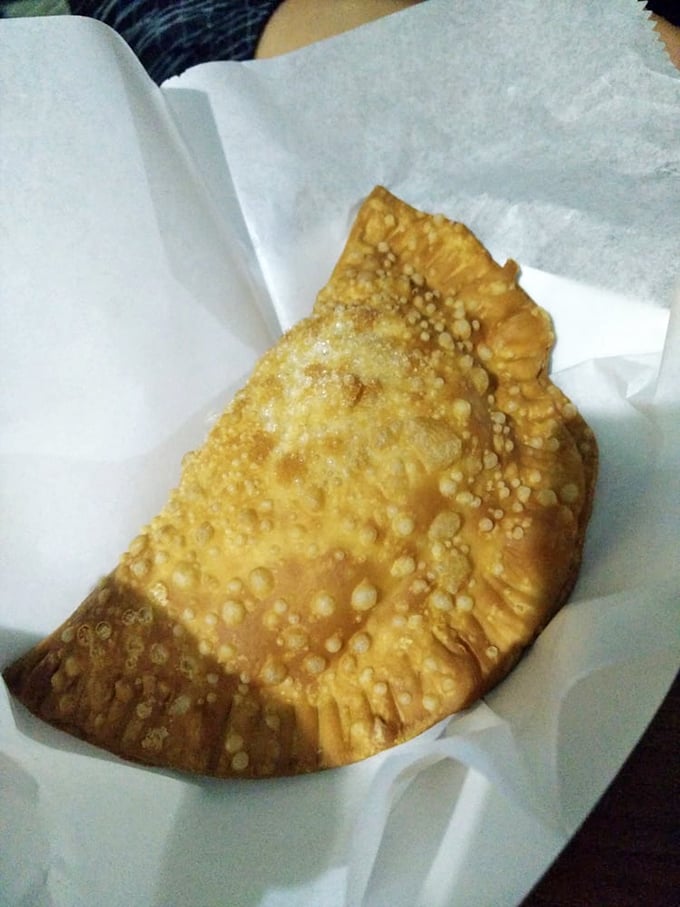 The golden-fried pastel isn't just an empanada&mdash;it's a crispy pocket of joy that shatters with each bite, revealing a filling that would make your grandmother jealous. 