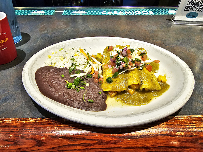These enchiladas aren't just wrapped, they're embraced &ndash; bathed in verde sauce and topped with enough fresh garnish to make a salad jealous.