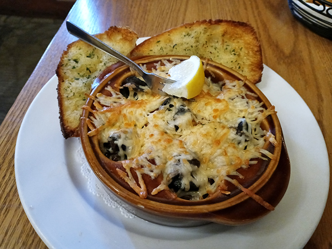 Escargot that would make Julia Child swoon—bubbling with garlic butter and cheese, these aren't your garden-variety snails but rather tiny vessels of French-inspired bliss.