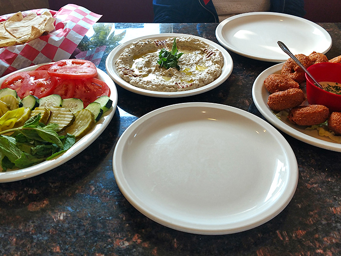 A colorful spread that proves vegetables can be exciting too. That hummus looks so creamy it could make a cardiologist temporarily suspend judgment.