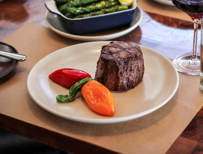 Behold, the filet that launched a thousand sighs. Perfectly seared on the outside, blushing pink within&mdash;this isn't just dinner, it's a bovine masterpiece with vegetable backup dancers.