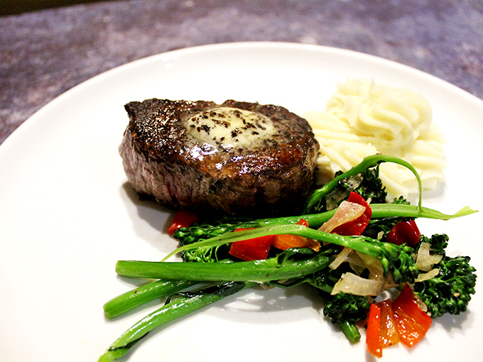 A perfectly cooked filet mignon that could make a vegetarian question their life choices. Butter-tender beef paired with vibrant vegetables.