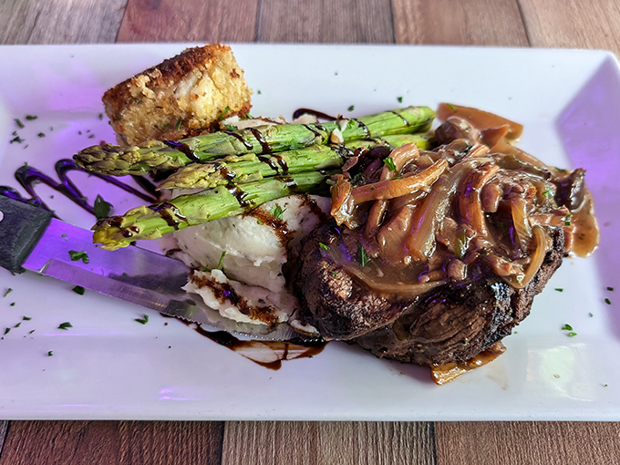 The filet mignon arrives like royalty with an entourage of asparagus, caramelized onions, and mashed potatoes. Meat this tender should require a love sonnet.