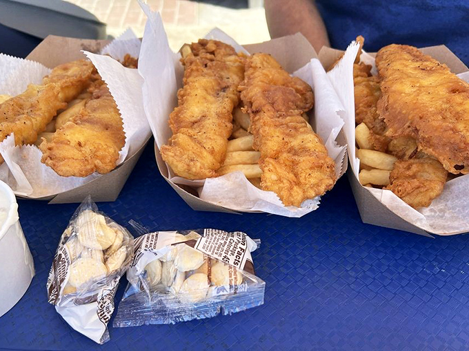 Golden-battered fish nestled atop crispy fries &ndash; the kind of comfort food that makes you wonder why anyone bothers with fancy dining.