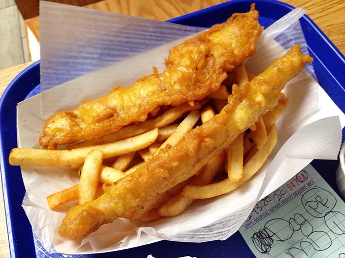 Golden-battered fish fillets lounging atop a bed of crispy fries. The kind of dish that makes you wonder why you ever eat anything else.