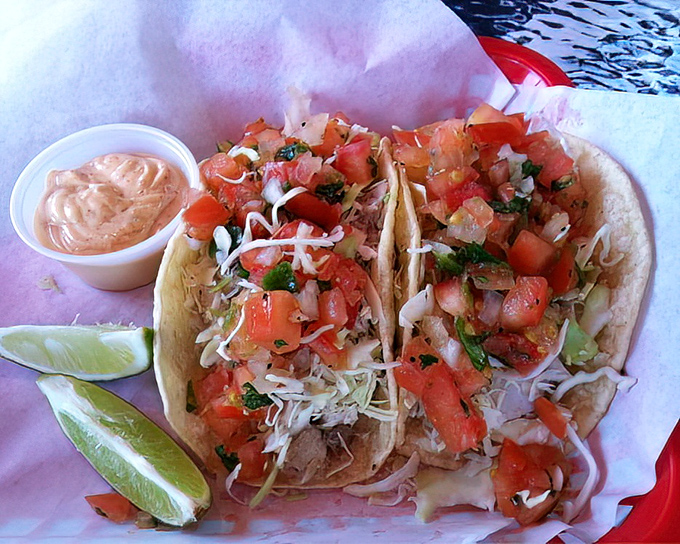 These fish tacos aren't just a meal; they're a coastal vacation on a corn tortilla. Fresh pico de gallo and that mysterious "TNT" sauce create flavor fireworks.