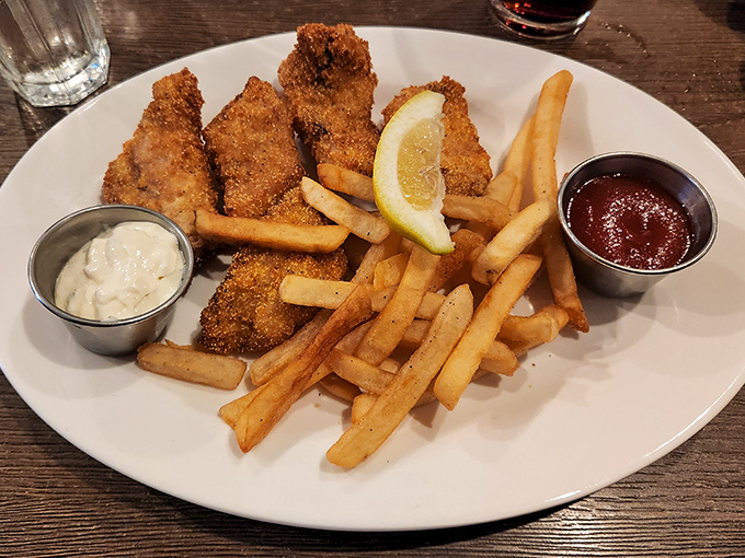 The legendary fish and chips &ndash; golden, crispy perfection that makes you wonder if you've ever truly had fish and chips before this moment.