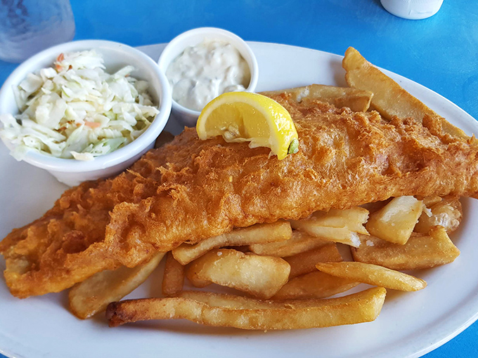 Golden-battered fish that shatters with each bite, paired with crispy fries and creamy coleslaw. The holy trinity of coastal comfort food done spectacularly right.