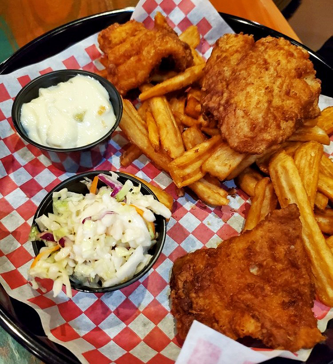 Golden-battered fish that shatters with each bite, alongside crispy fries and creamy coleslaw. The holy trinity of comfort food gets the Florida treatment.