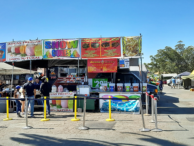 Snow cones and street food beckon hungry shoppers with vibrant banners and the promise of flavors that taste even better when enjoyed between treasure hunts.