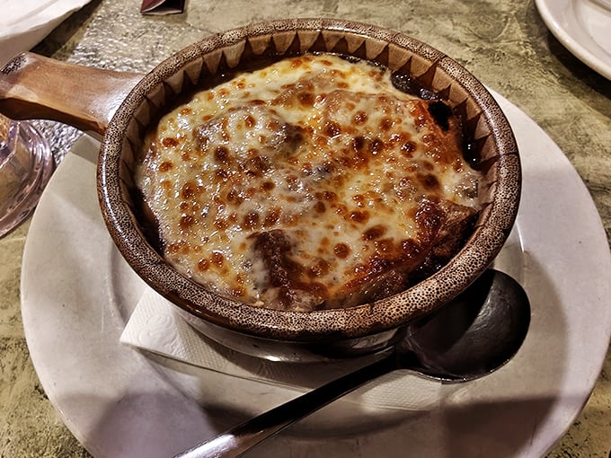 Behold the crown jewel: French onion soup with a cheese cap so perfect it deserves its own Ohio state holiday.
