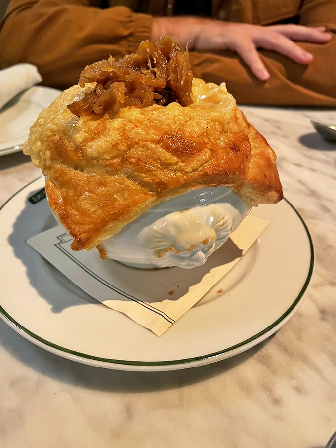 Not just soup, but a geological marvel&mdash;layers of caramelized onions, rich broth, and a cheese cap that stretches like a gymnast.