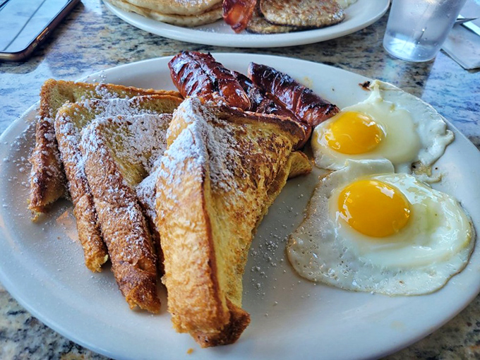 French toast that's achieved golden-brown perfection, with eggs sunny enough to brighten even Monday mornings. Breakfast nirvana exists!
