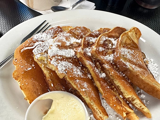Golden-brown French toast that's achieved celebrity status for good reason. Dusted with powdered sugar and served with a side of "why don't I eat this every day?"