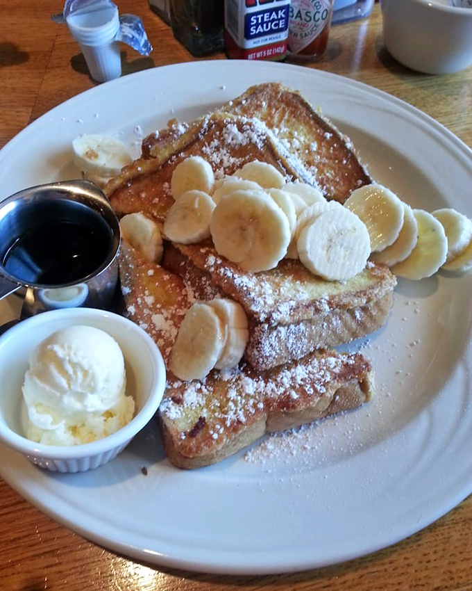 French toast that could make a carb-counter weep with joy. Those banana slices aren't decoration—they're essential supporting actors in this breakfast drama.