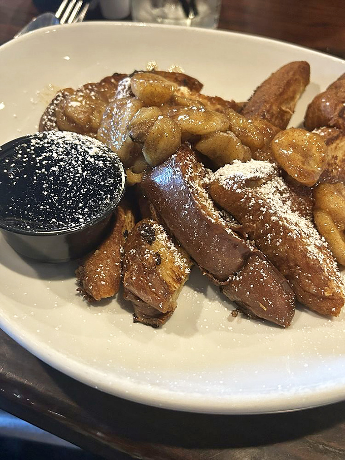 French toast that deserves its own thank-you note. Perfectly caramelized with apple topping and a dusting of powdered sugar&mdash;breakfast transcends into dessert territory without apology.