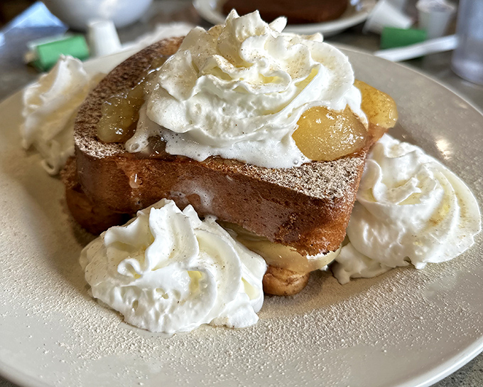 This isn't just French toast &ndash; it's a cinnamon-dusted cloud with apple filling that makes you wonder if breakfast should actually be classified as dessert.