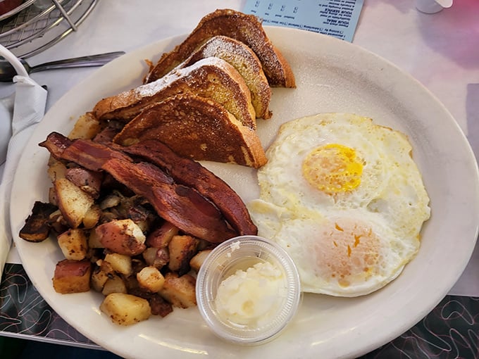 French toast that's achieved golden perfection, eggs with yolks as sunny as an Arizona morning, and bacon that's found crispy nirvana.